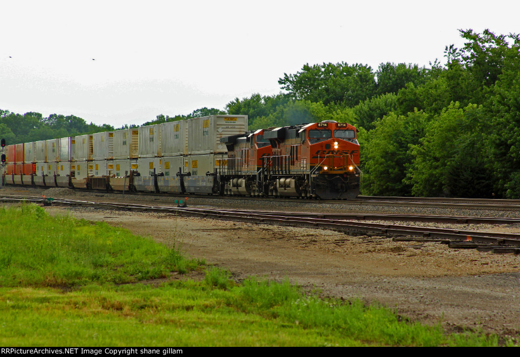 BNSF 6714 Heads off EB with a z train in tow.